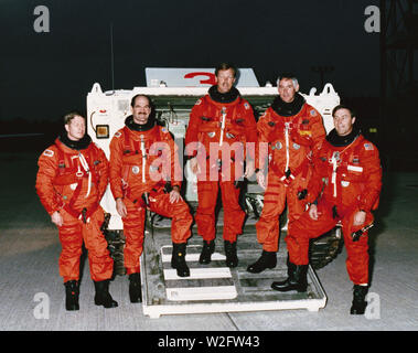 STS-27 Mission Specialist (MS) Richard M. (Mike) Mullane is surrounded ...