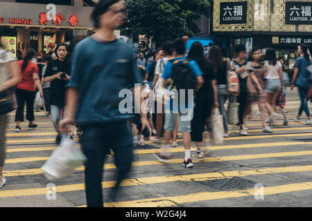 Causeway Bay, Hong Kong, 08 July 2019: Commuter in busy crosswalk ...
