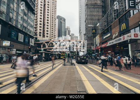 Causeway Bay, Hong Kong, 08 July 2019: Commuter in busy crosswalk ...