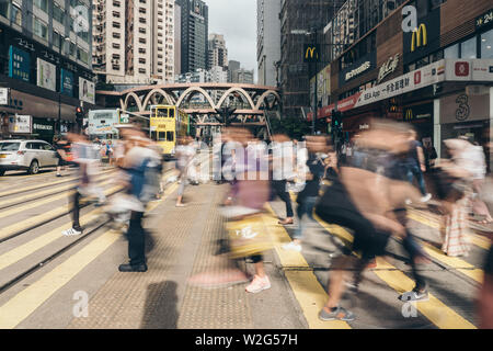 Causeway Bay, Hong Kong, 08 July 2019: Commuter in busy crosswalk ...