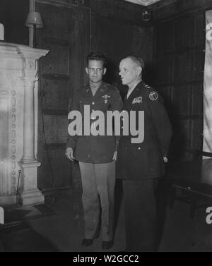 Maj. Gen. Charles H. Corlett, right, awards Maj. Roy L. Atteberry the ...