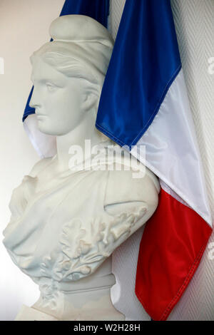 French flag and Statue of Marianne, national symbol of the French ...