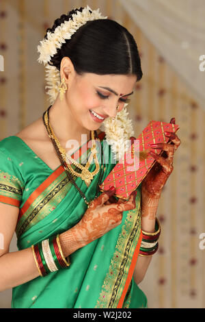Woman holding envelopes and smiling Stock Photo - Alamy