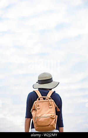 Women shoulder backpack and Wear a hat Background corn fields Stock ...