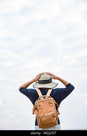 Women shoulder backpack and Wear a hat Background corn fields Stock ...