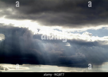 SUNSCREEN: Clouds in a distant Virginia sky filter the sunrays through ...