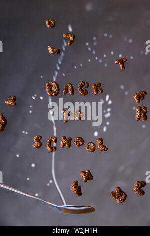 Chocolate cornflakes in the shape of letters of the English alphabet ...