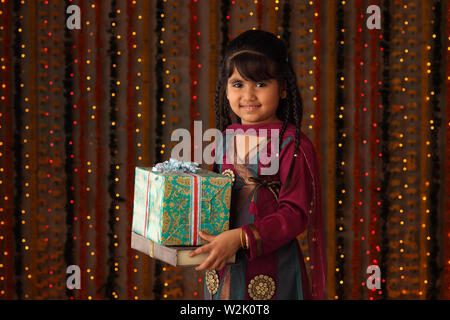 A black girl portrait with box braids hairstyle smiling at camera. A ...
