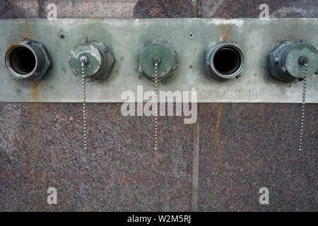 Combination fire standpipe and sprinkler on the wall of an office ...