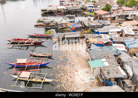 Houses and boats of the poor inhabitants of Manila. Dwelling poor in ...