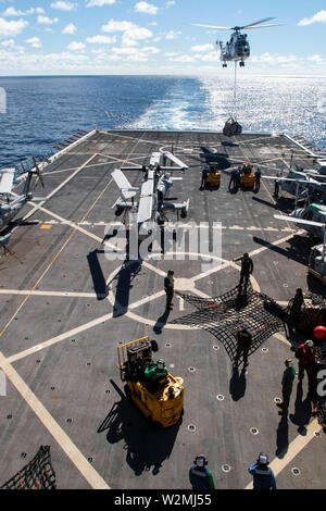 US Navy An SA-330 Puma helicopter carries supplies from Military ...