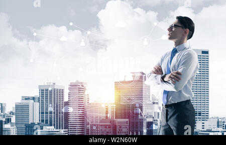 Business concept. Against the background of the world map, a man holds ...