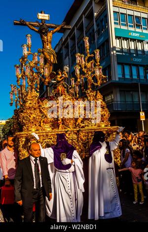 Penitent in traditional hood and robe in an Easter parade on Holy ...