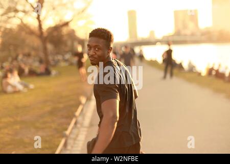 Man Running Looking Over His Shoulder, motion blur Stock Photo - Alamy