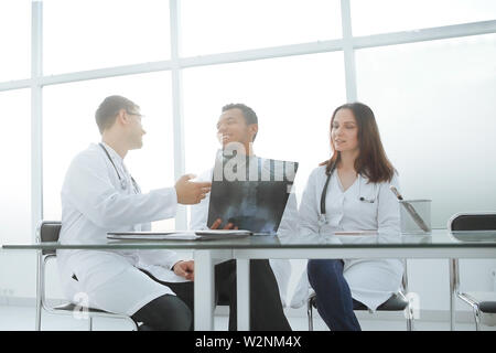 employees of the medical center sitting at his Desk . the concept of ...