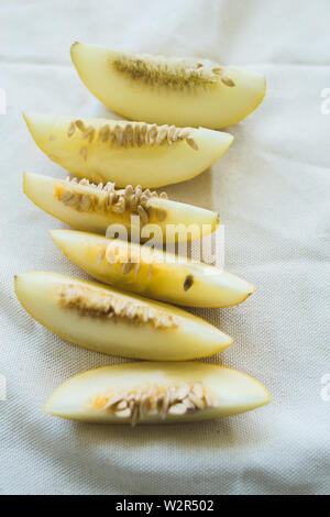 A group of brightly lit melon slices. seasonal summer fruits Stock ...
