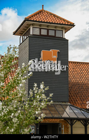 SWINDON, ENGLAND - JULY 2018: Signs on the outside of a Beefeater chain ...