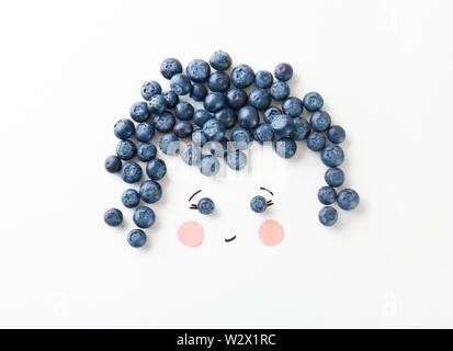 Cute face made of ripe blueberry on white background Stock Photo - Alamy