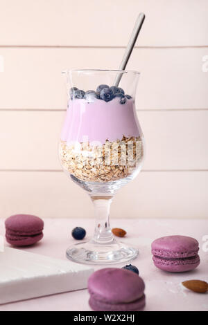 Macarons and berries on white table Stock Photo - Alamy