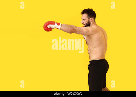 Strong male boxer on color background Stock Photo - Alamy