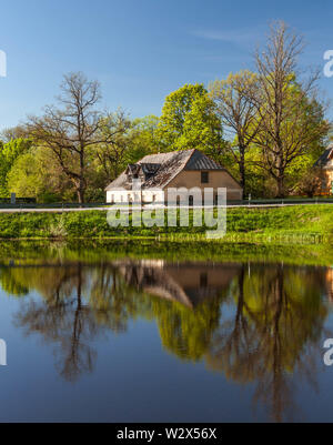Castle with reflection in pond in spring time in Pruhonice, Czech ...