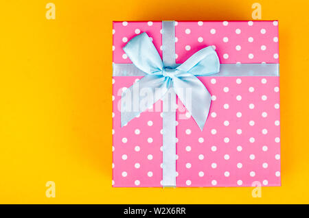 Square box of pink polka dots on bright background Stock Photo - Alamy