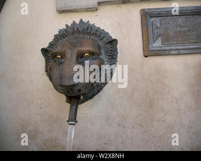 public fountain in Nemi, head of a wolf Stock Photo - Alamy