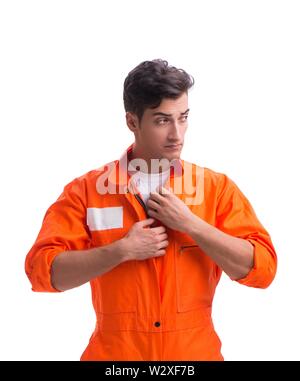 Depressed prisoner in orange uniform sits on bed in prison cell, smokes ...