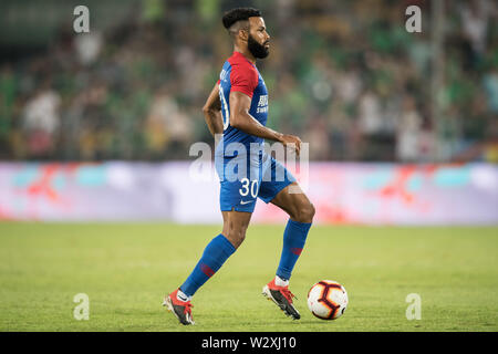 Brazilian football player Luiz Fernandinho of Chongqing SWM jumps to ...