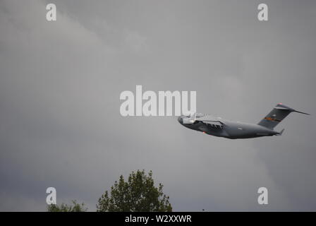 C 17 Globemaster taking off against a grey cloudy sky Stock Photo - Alamy