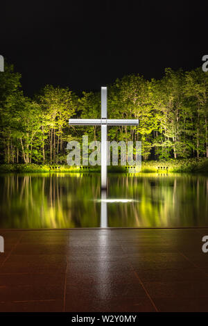 Cross on the water with an inverted reflection in a beautiful nature ...