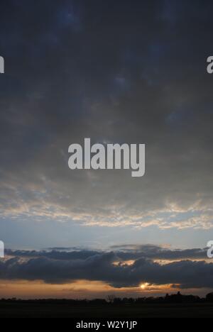 majestic sweeping evening clods in the sky over the landscape of ...