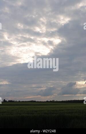 majestic sweeping evening clods in the sky over the landscape of ...