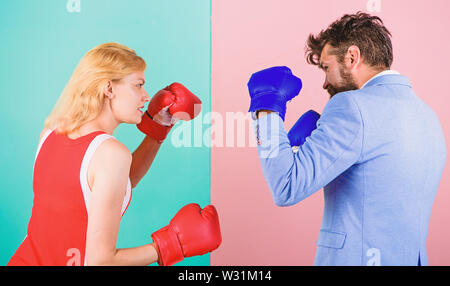 Gender battle. Gender equal rights. Family quarrel. Boxers fighting in ...