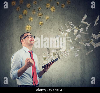 Businessman holding a lightbulb concept Stock Photo - Alamy