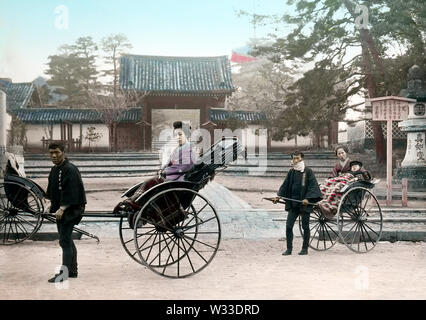Two women wearing traditional Victorian bathing costumes on the beach ...