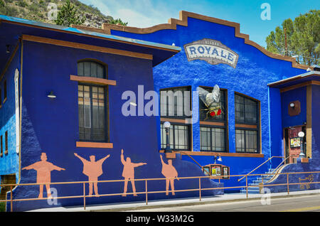 The entrance to Bisbee Royale, with a giant fly sculpture on window, a ...