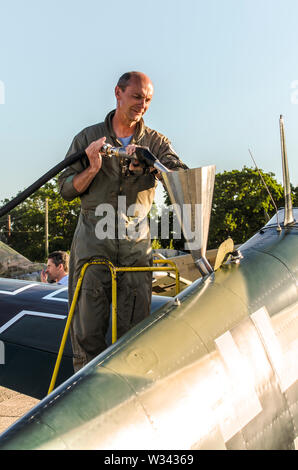 Pilot Lee Proudfoot refuelling a Buchon fighter plane at Headcorn ...