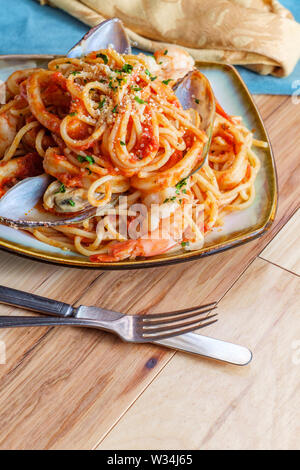 Italian seafood pasta pescatore with mussels clams shrimp and squid ...