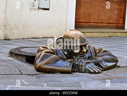 Statue of Cumil, the man at work in a hole, Bratislava, Slovakia ...