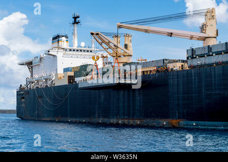Sailors assigned to Navy Cargo Handling Battalion 1 (NCHB1) guide an ...