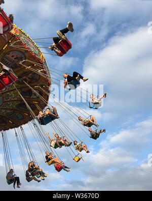 Spinning Swings at Amusement Park Stock Photo - Alamy