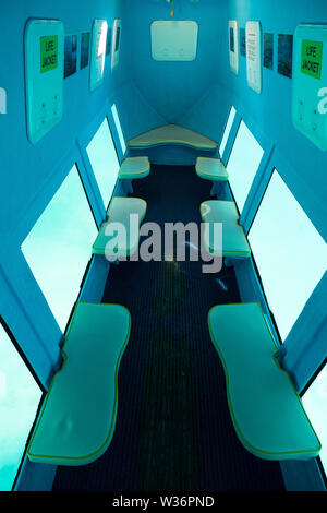 Underwater view of bottom of boat looking up through Snell's window ...