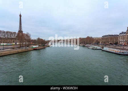 Tourist boat at Sienna river, Paris skyline with Eiffel tower in ...