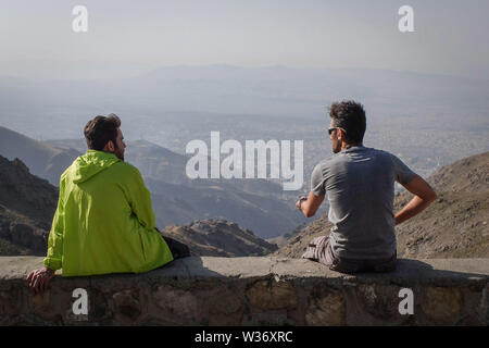 Tehran, Iran. 12th July, 2019. Two men riding motorcycles at Tochal ...