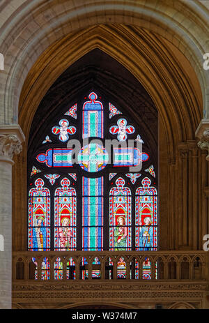 An old arched church window with decorative elements on the wall Stock ...