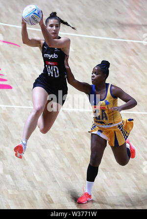 New Zealand's Karin Burger (left) and Barbados' Shenique Thomas battle ...