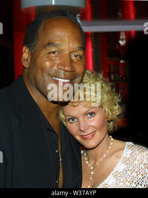 OJ Simpson and friend Tammy Wu 2002 Photo By Adam Scull ...