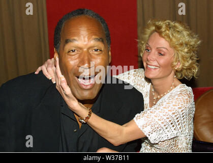 OJ Simpson and friend Tammy Wu 2002 Photo By Adam Scull ...