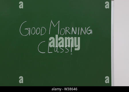 Close up of a blackboard with Morning Class written on it in chalk ...
